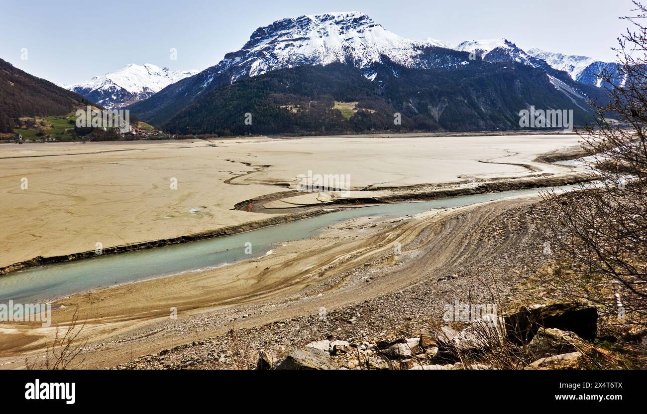 Meandering dry channels in the drained reservoir on the Reschen Pass in ...