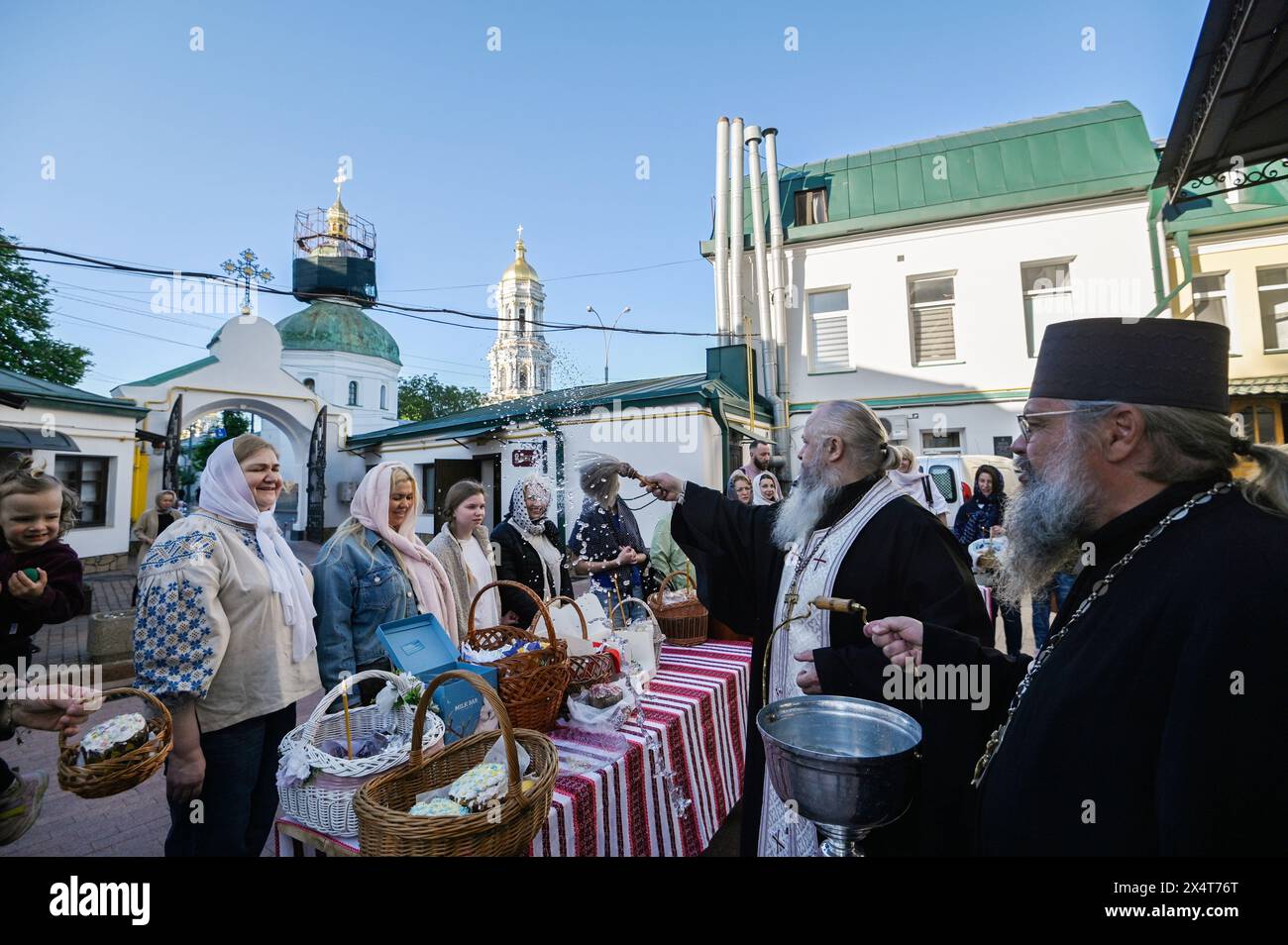 Kyiv, Ukraine. 04th May, 2024. An Orthodox priest seen blessing the traditional Easter cakes and ...
