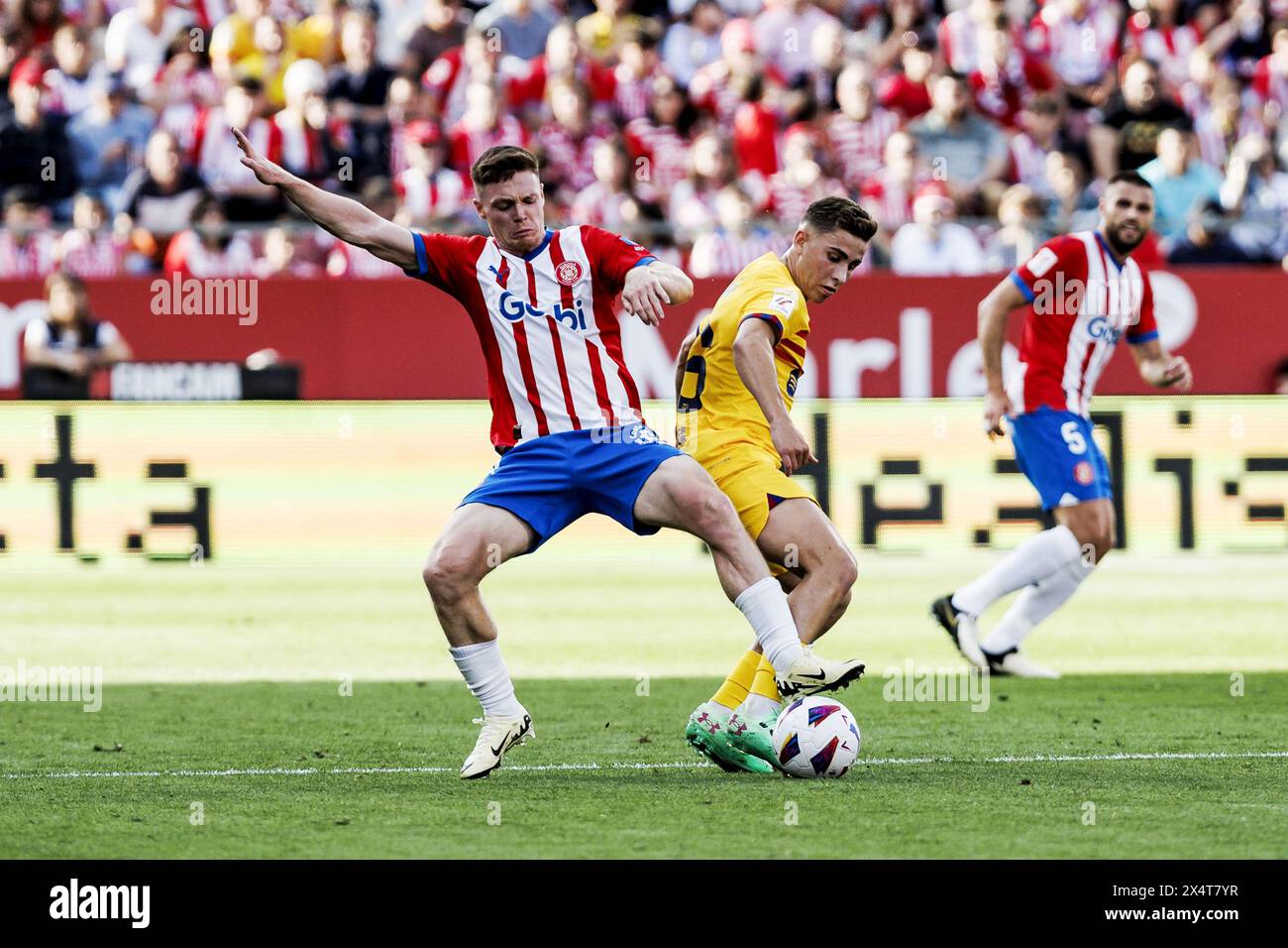 Viktor Tsygankov of Girona FC and Fermin Lopez Marin of FC Barcelona ...