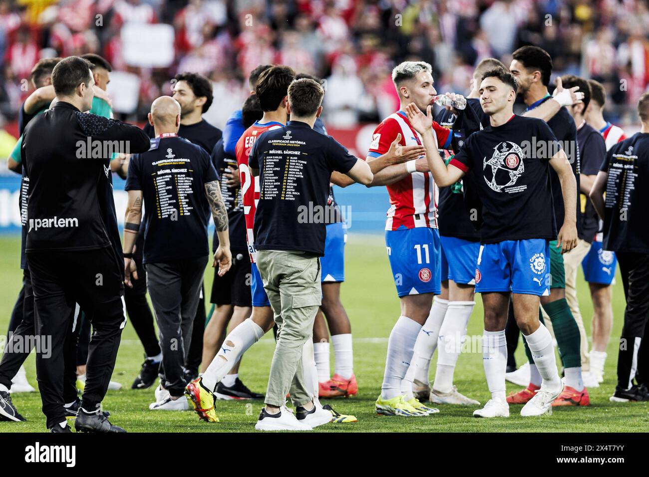 Players of Girona FC celebrate qualification for the Champions League after the Spanish ...