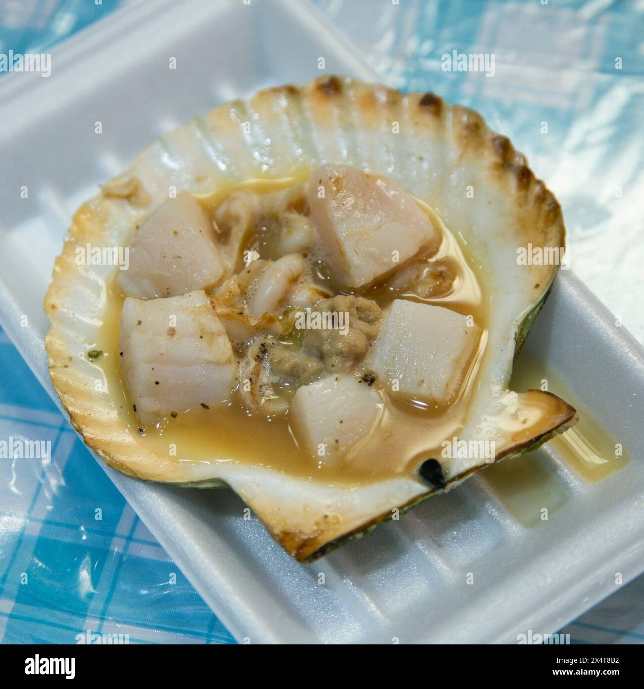 Seafood shell and fish cooked on a grill at the Osaka fish market in ...