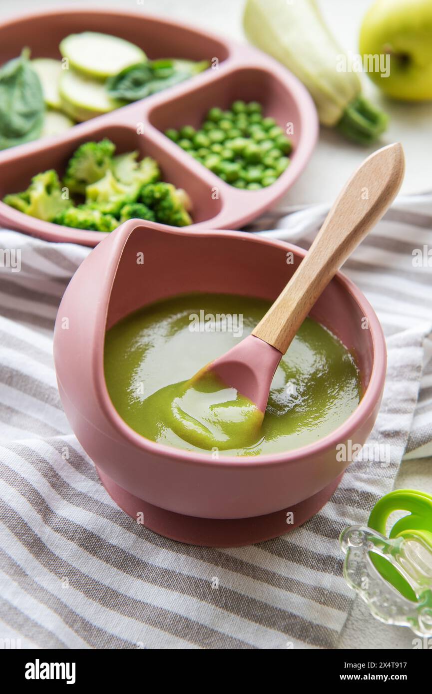Healthy baby food in bowl. Baby food vegetable puree with broccoli and ...