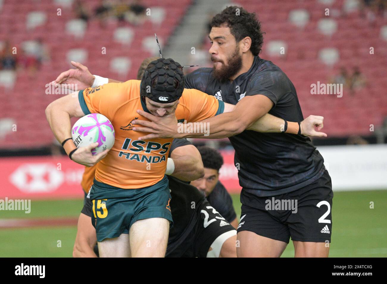 Singapore. 5th May, 2024. New Zealand's Brady Rush (R) fights for the ...