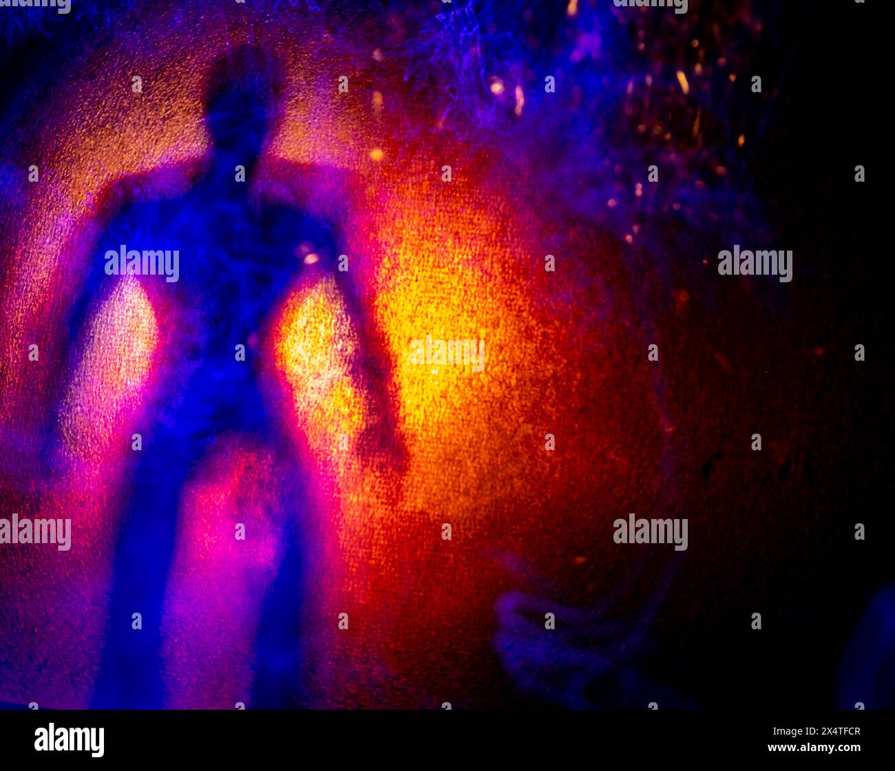 Human silhouettes between lights. Light painting in the dark ...