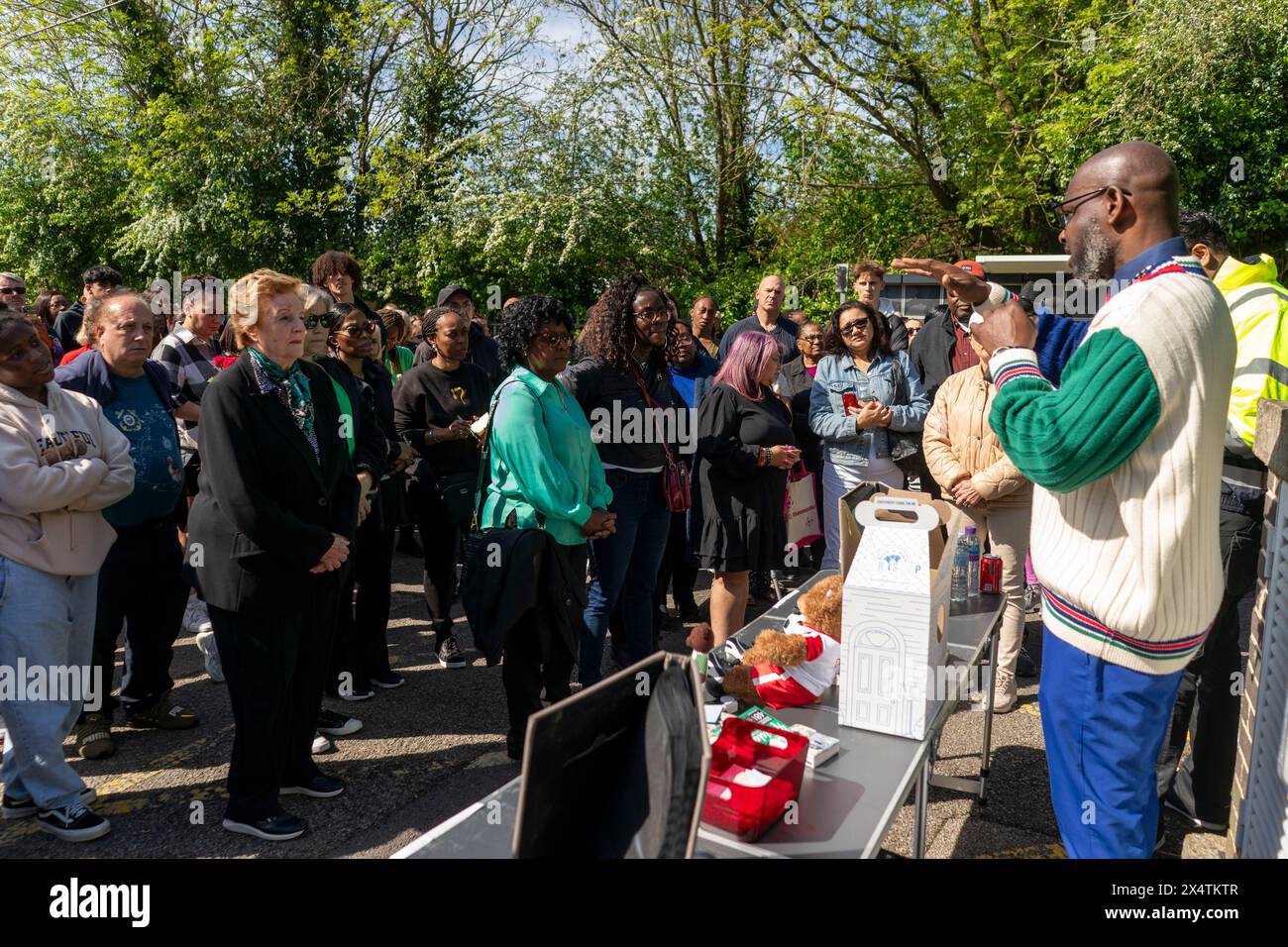 People attend a vigil at Hainault Underground Station Car Park, north ...