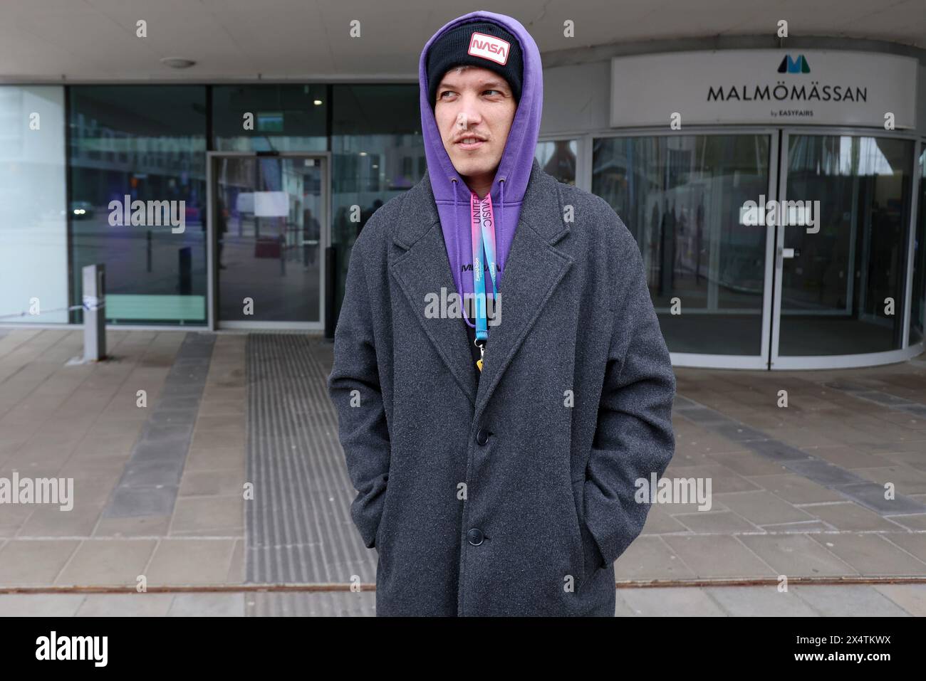 Artist Marko Purisic also known as Baby Lasagna is seen in fromt of ...