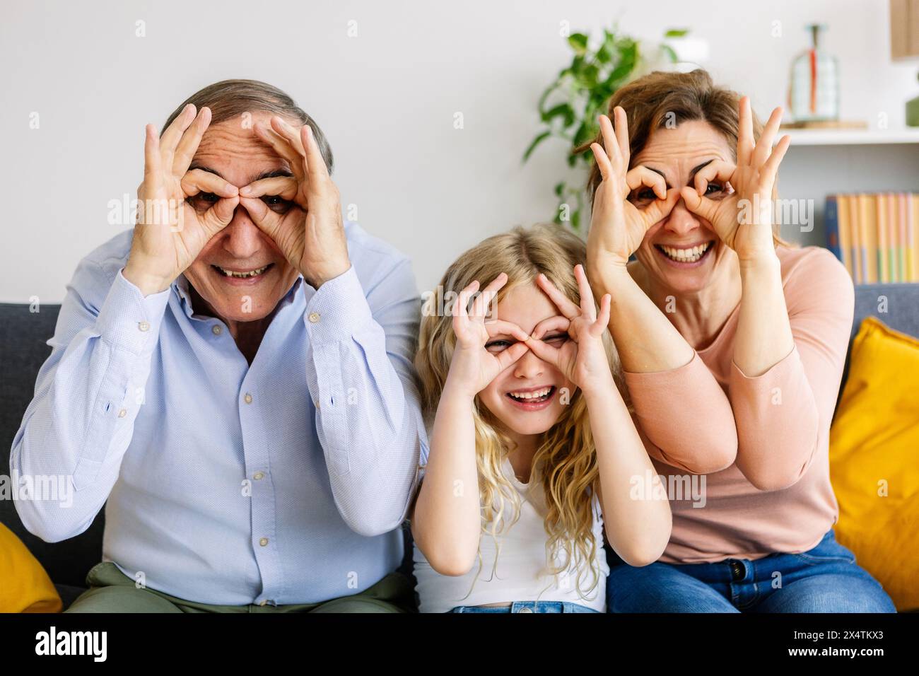 Portrait of happy multi-generational family having fun doing funny ...