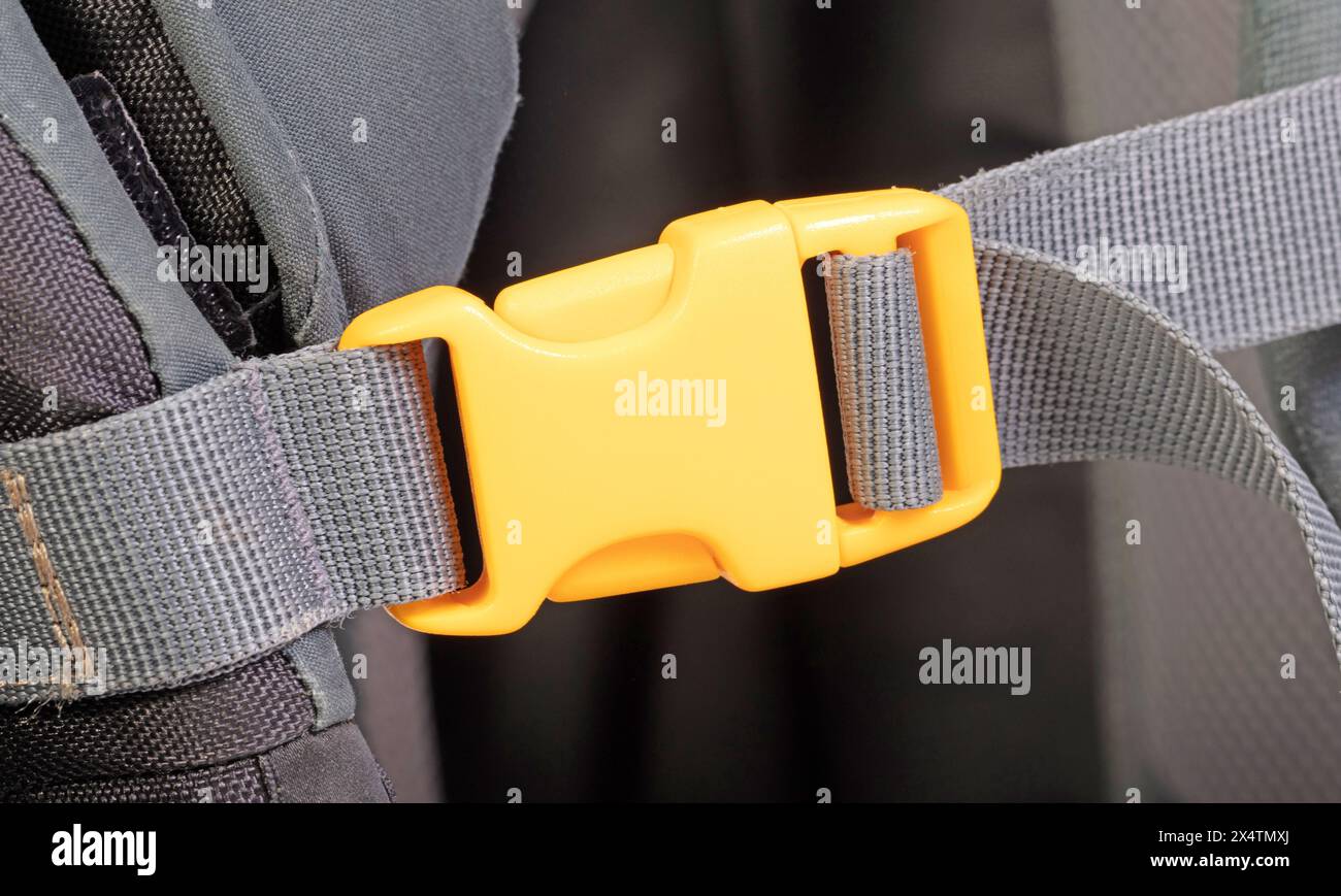 Yellow plastic clasp of backpack, full frame image Stock Photo - Alamy