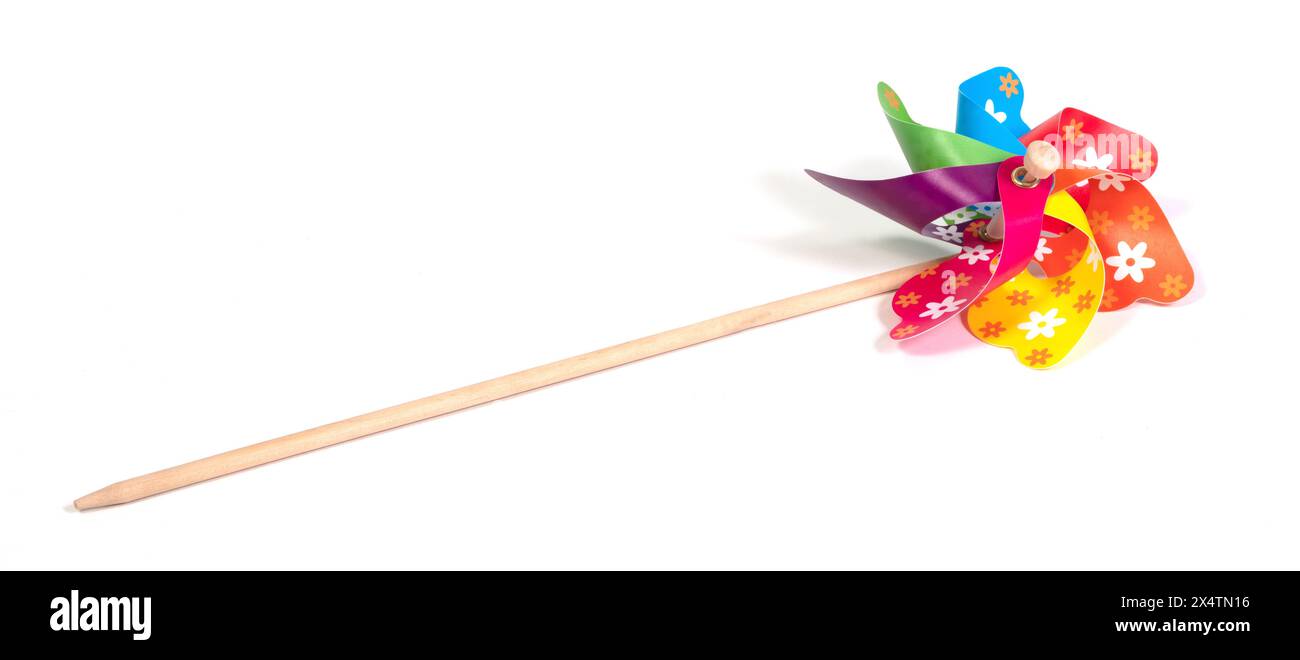 Colorful pinwheel, spinning toy with wooden stick, isolated Stock Photo ...