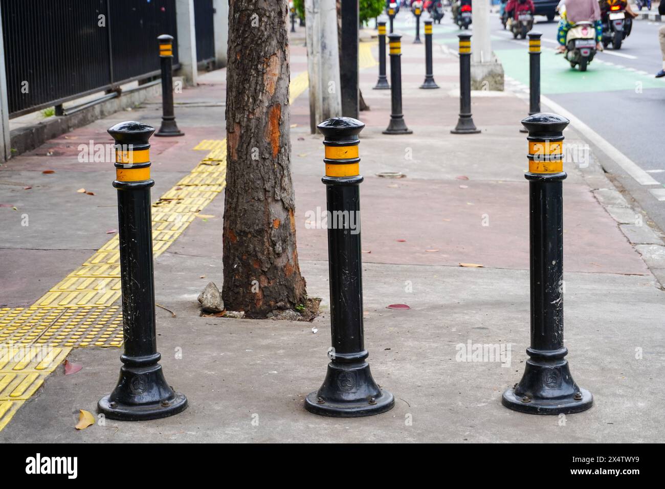 Pedestrian safety bollards at a street corner Stock Photo - Alamy
