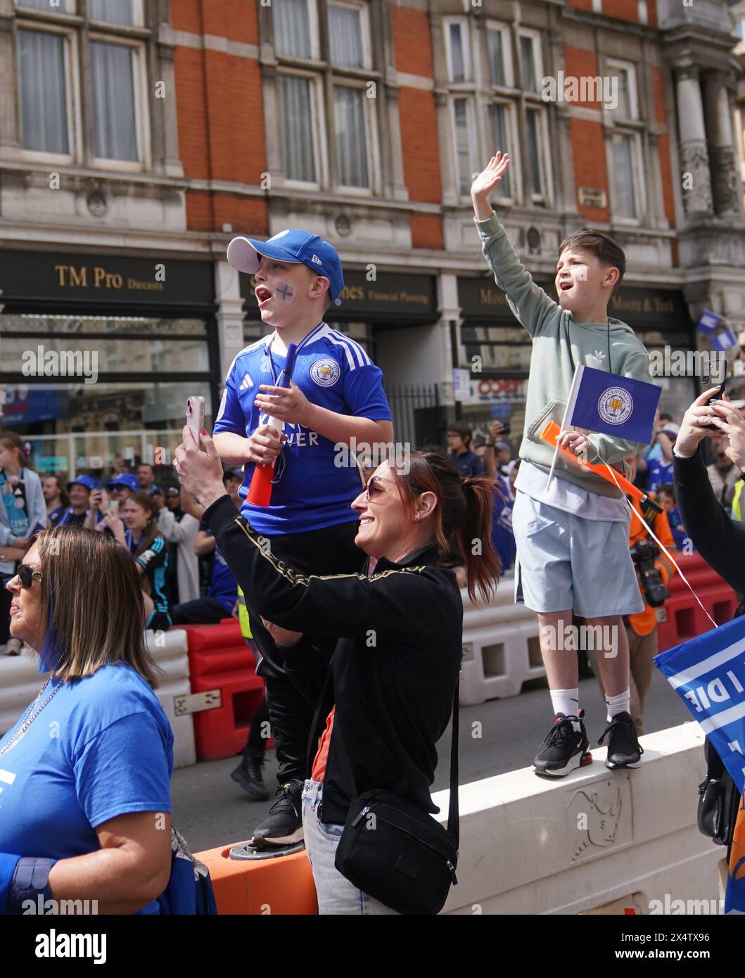 Leicester City fans celebrate during an open-top bus parade in ...