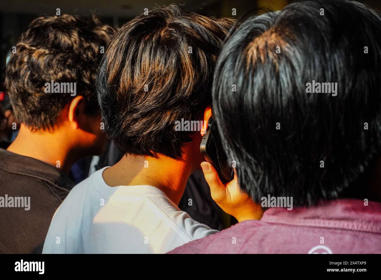 Phone call looking in crowd hi-res stock photography and images - Alamy