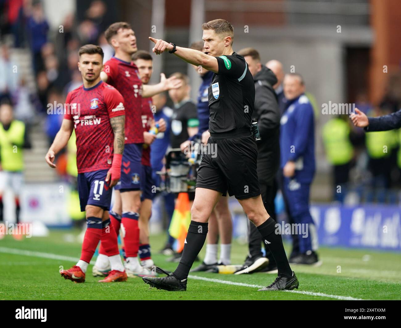 Referee David Dickinson awards a penalty to Rangers during the cinch ...