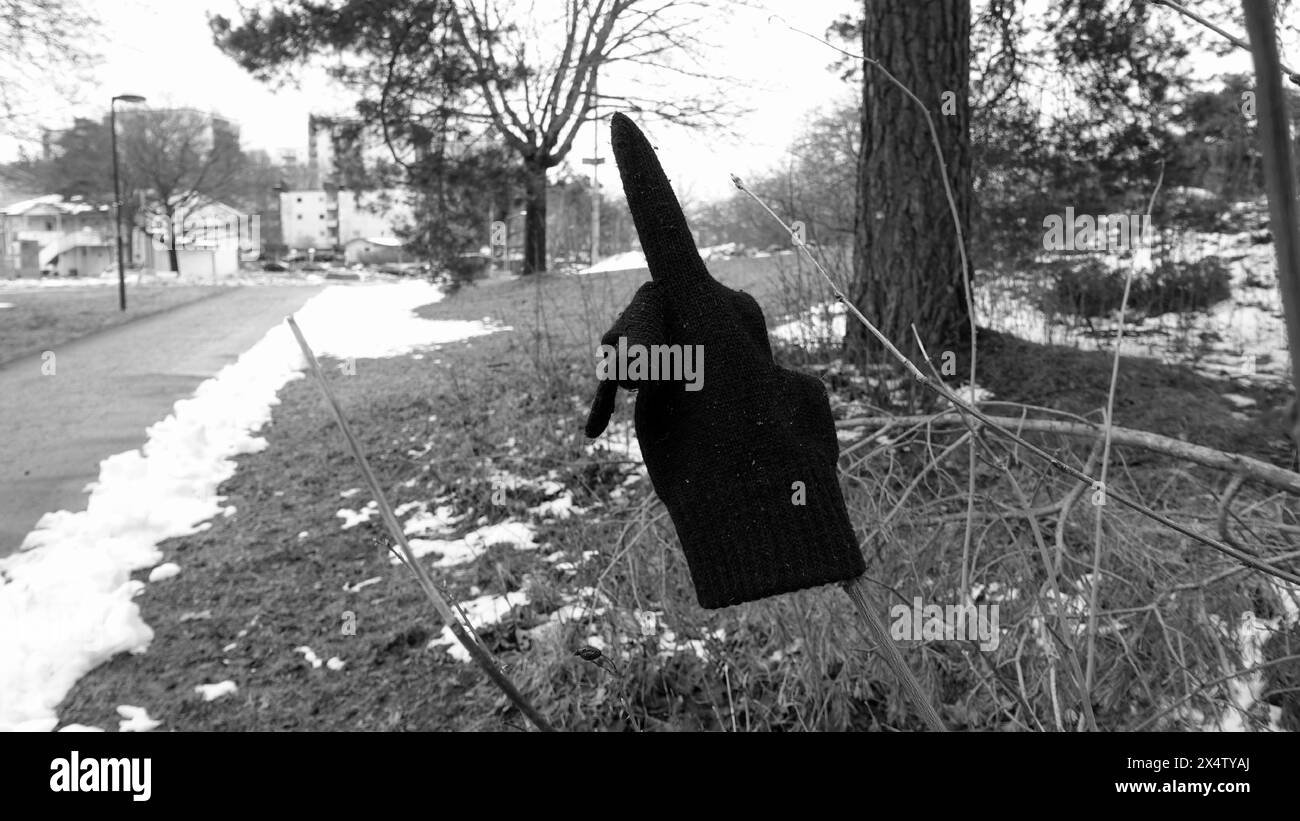 Glove middle finger hand Black and White Stock Photos & Images - Alamy