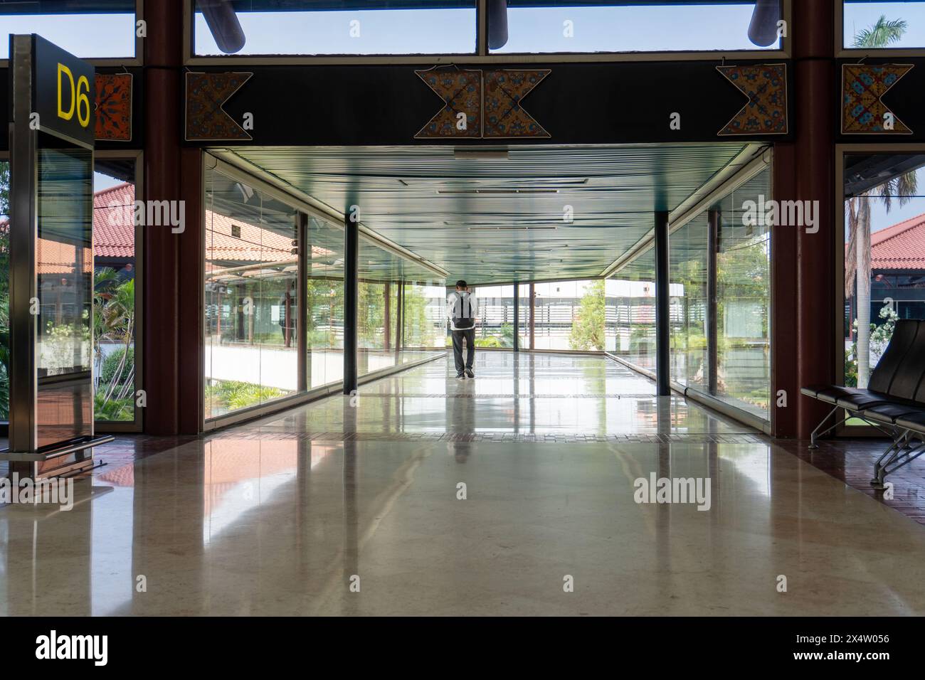 Man Walks Towards Gate D6 for Boarding at the Airport. Terminal Trek ...