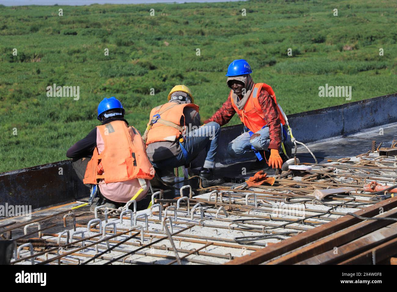 Mwanza. 2nd May, 2024. Tanzanian builders work at the construction site of the Magufuli Bridge ...