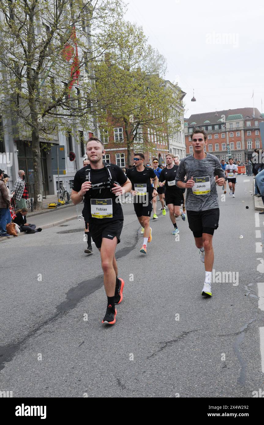 Copenhagen/ Denmark/05 MAY 2024 2024/ Participants running Copenhagen Marathon on danish flag ...