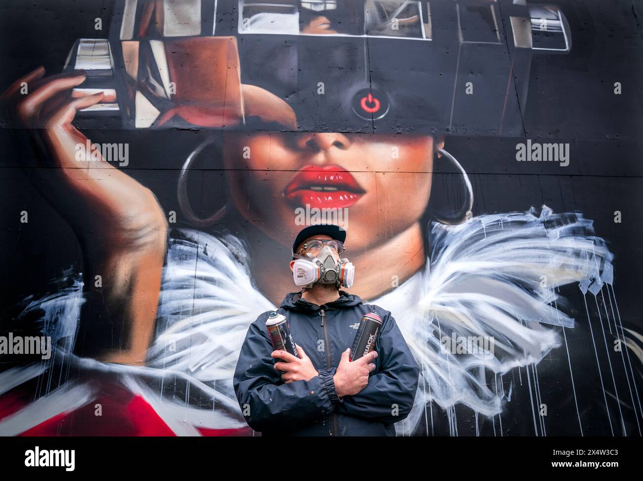 Artist 'epod3000' alongside his work at the Yardworks Festival 2024 in ...