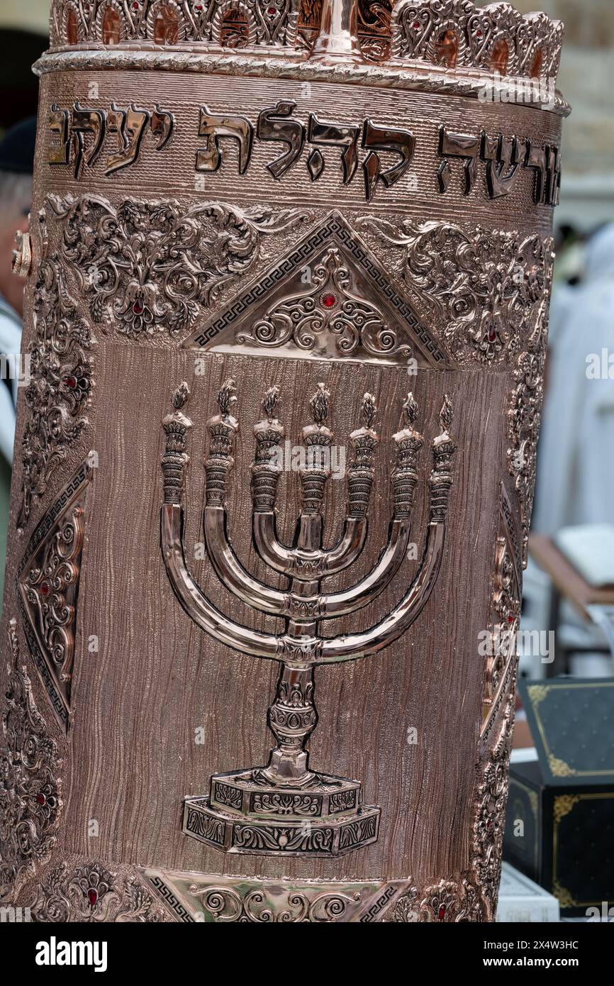 A decorative, Sephardic style Torah in a copper case designed with a ...