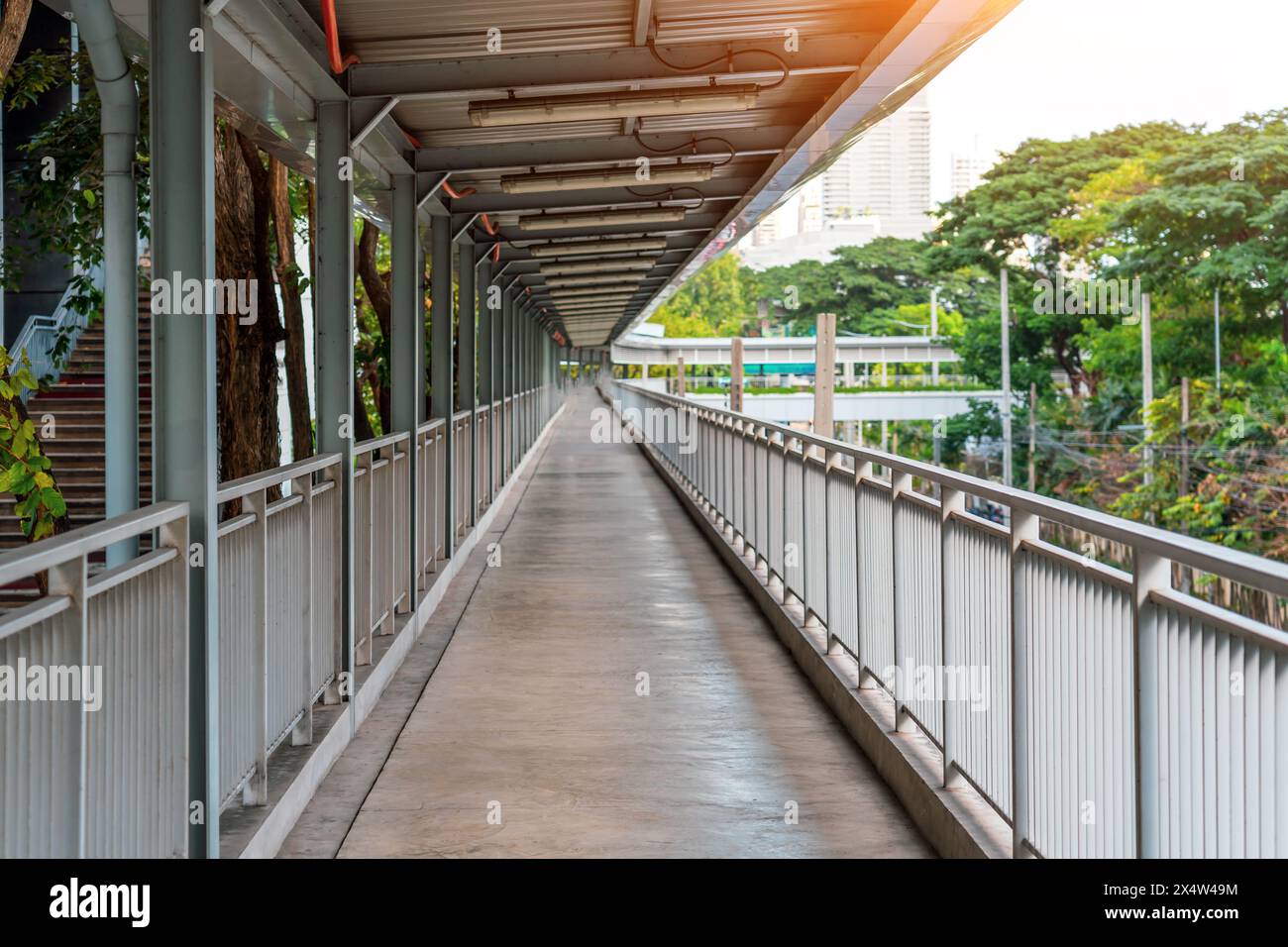Sheltered walkway of an overhead bridge in a residential neighborhood ...