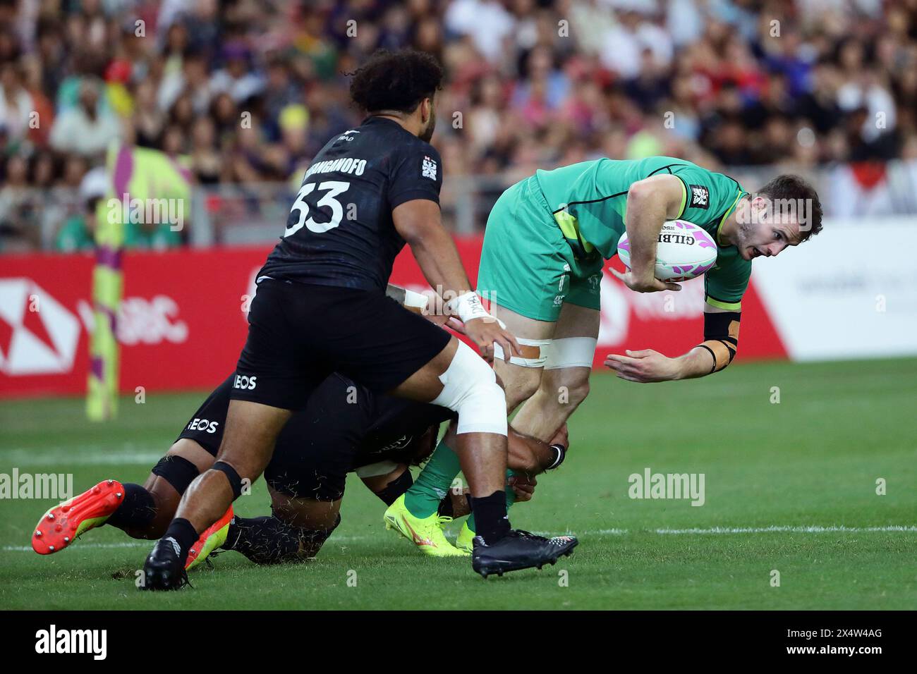 Dylan Collier of New Zealand tackles Jack Kelly of Ireland during the ...