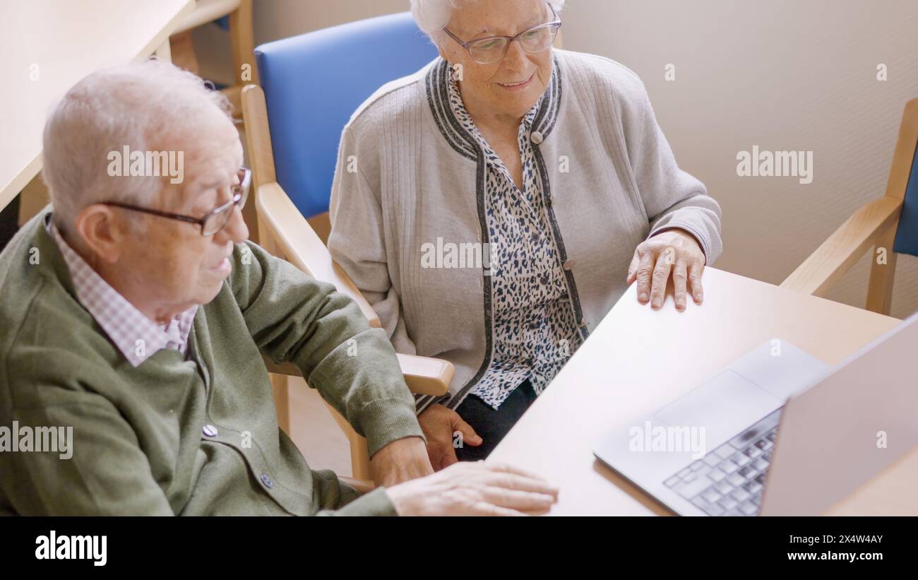 Grandparents using laptop during a video call Stock Photo - Alamy