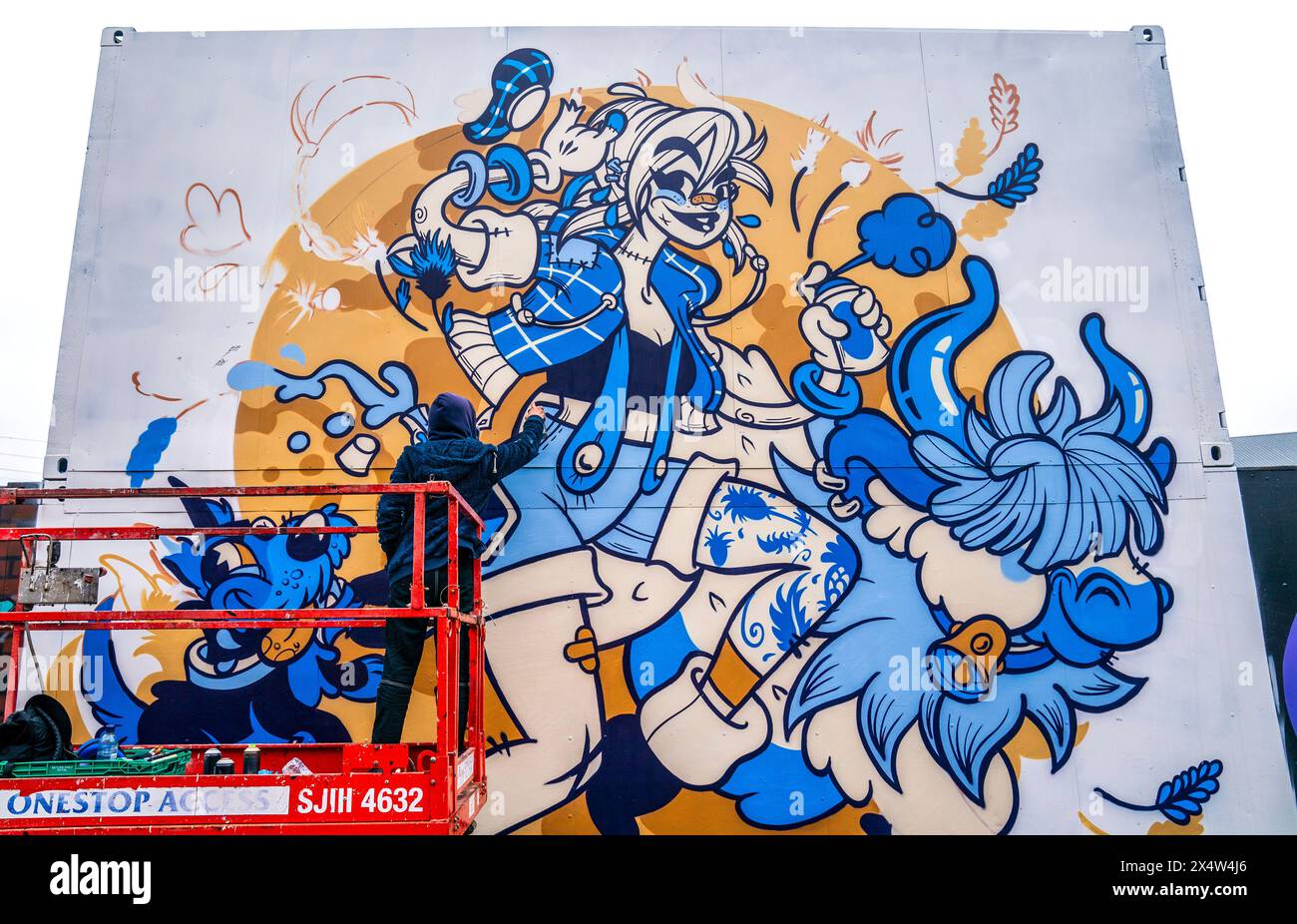 Artist Williann works on her Scottish-themed mural at the Yardworks ...