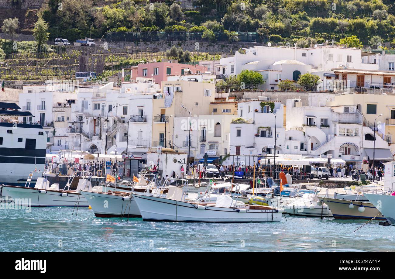 Capri Italy; Capri harbour, waterfront and town in sunshine in Spring ...