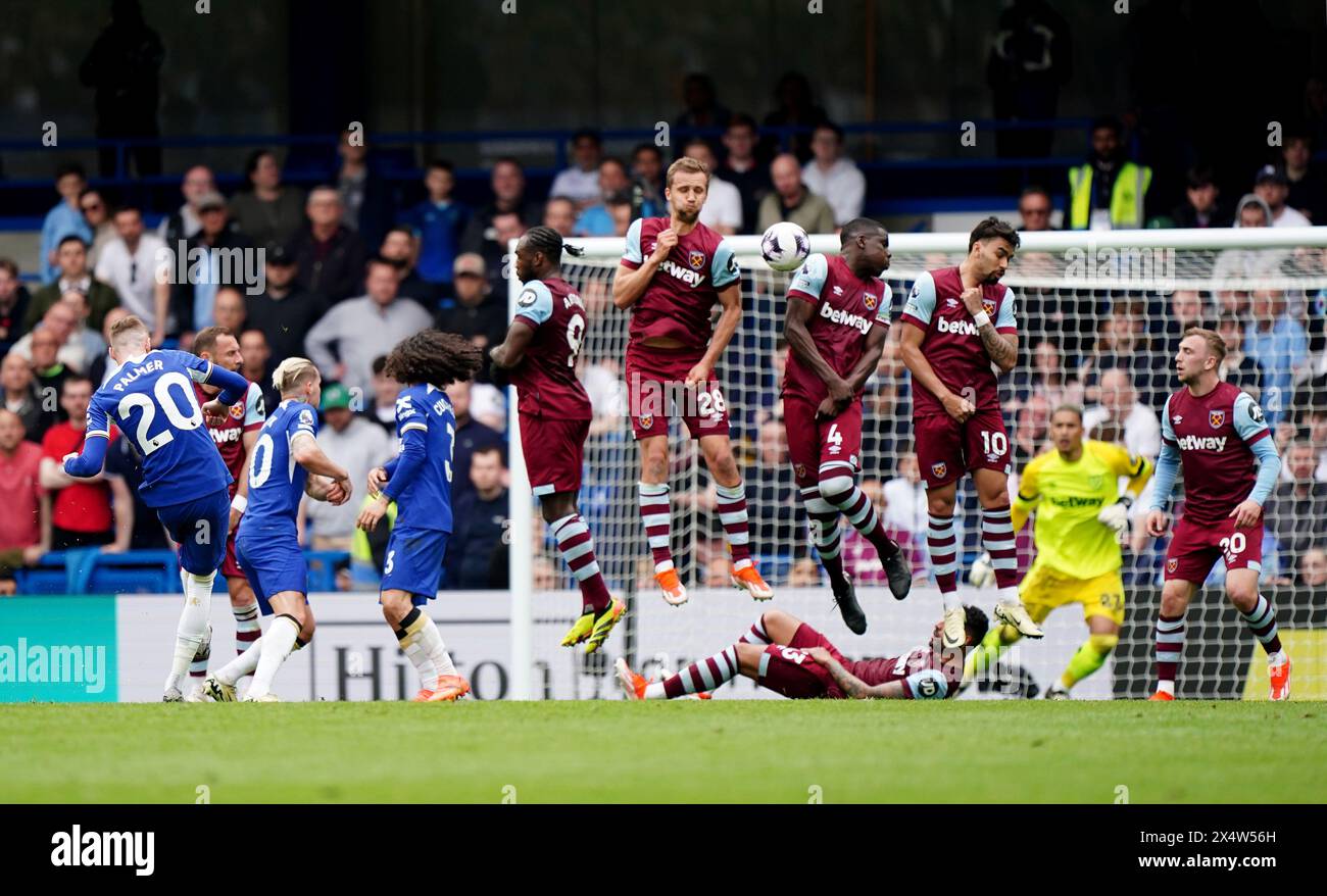 Chelsea's Cole Palmer (left) has a shot at goal from a direct free kick ...