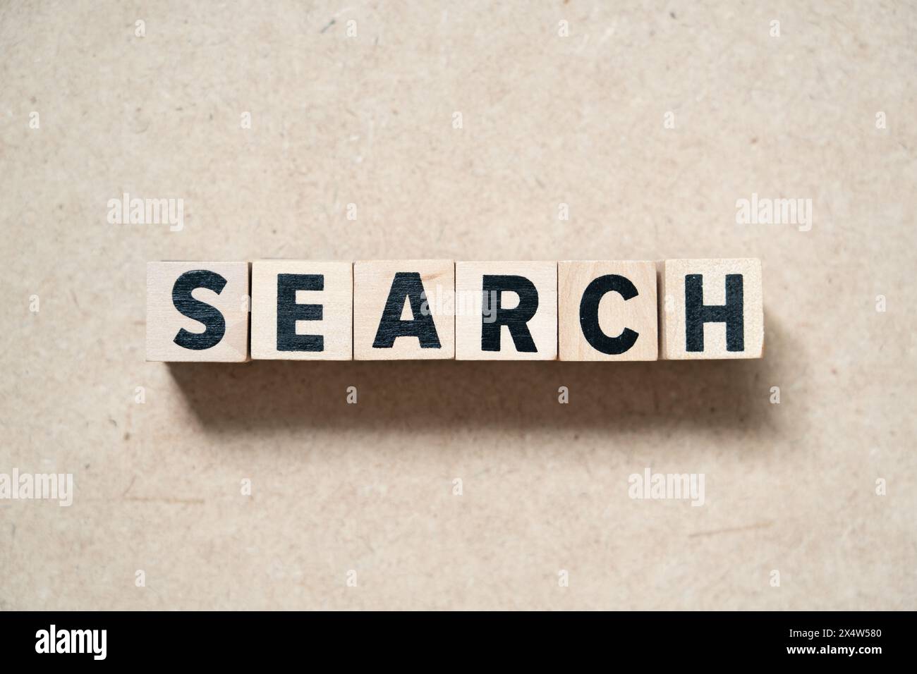 Alphabet letter block in word search on wood background Stock Photo - Alamy
