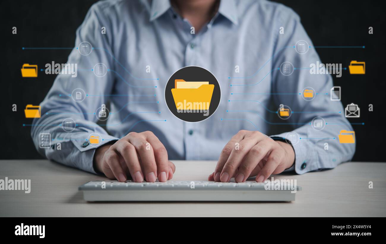 Professional working on computer with document management system ...