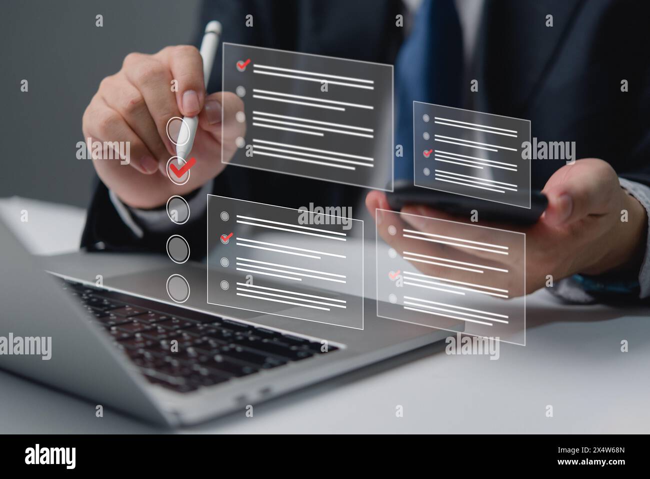 Businessman holding a digital checklist with checkboxes,assessment ...