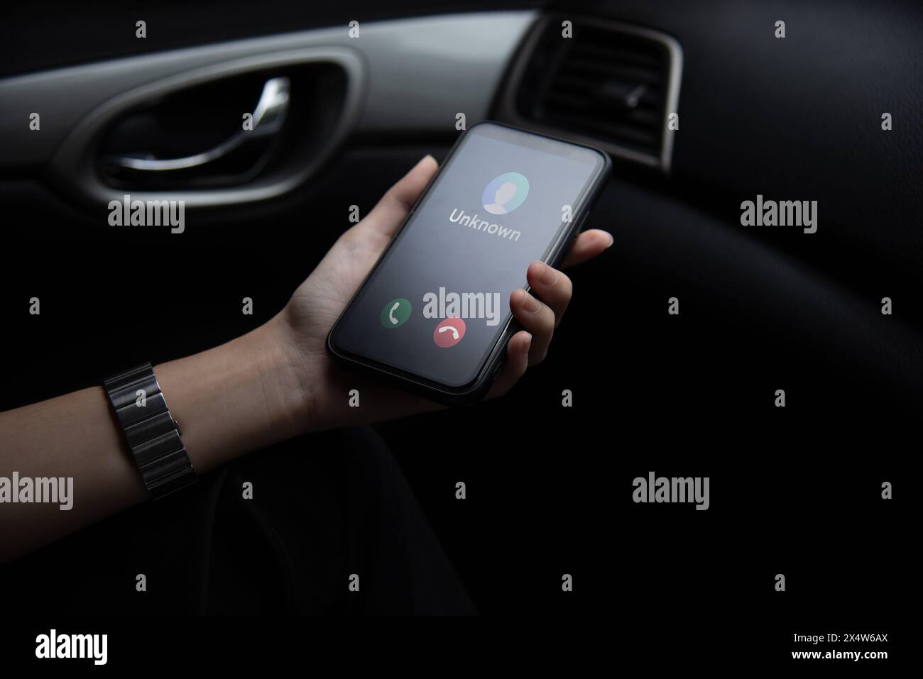 Hand holding a smartphone displaying an unknown caller ID Scam, fraud ...