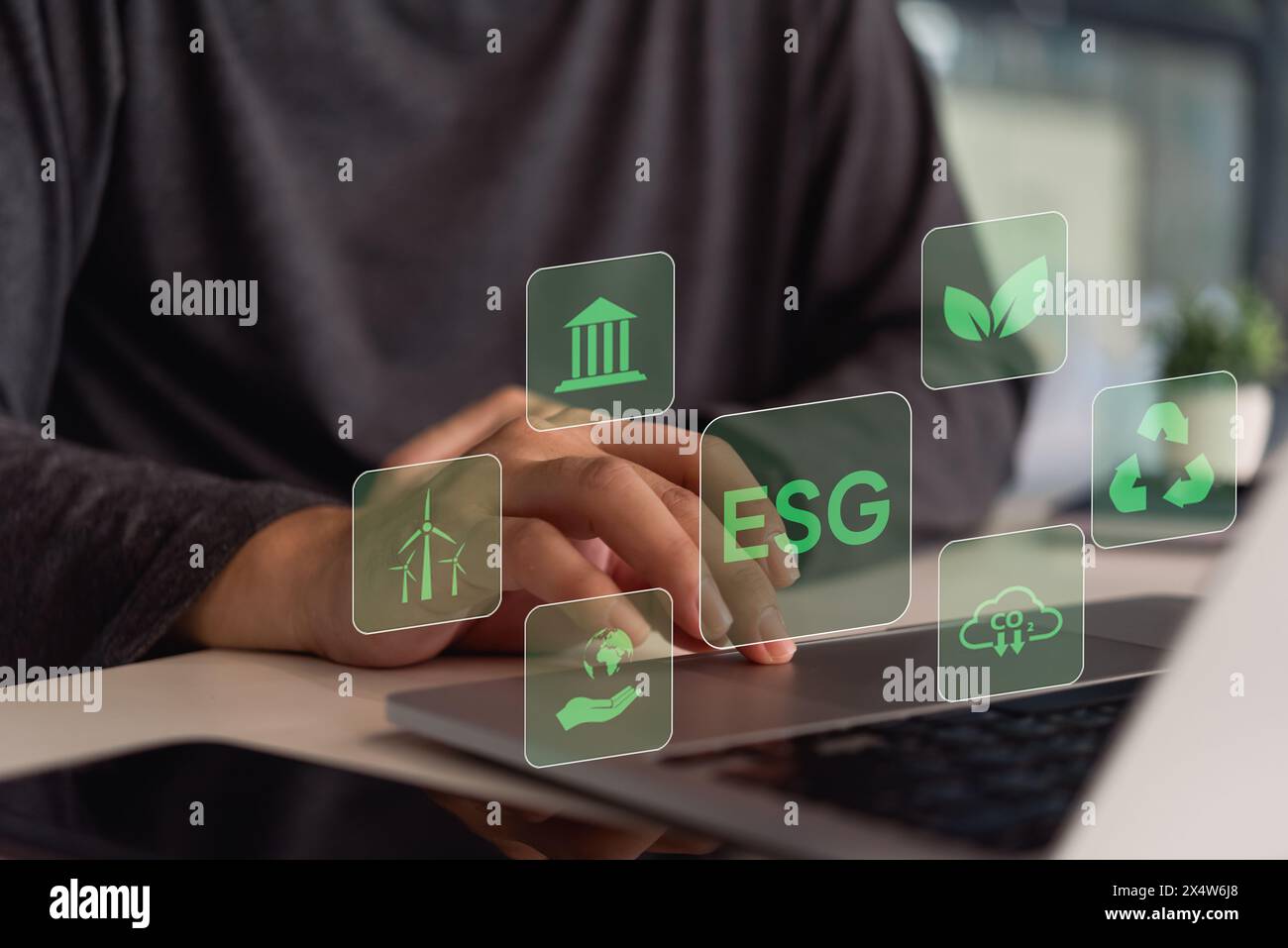 A person interacts with a digital interface showing icons related to ...