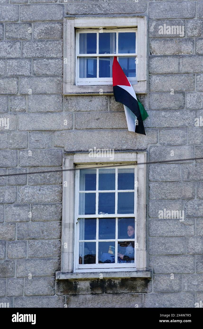 Palestine flags hang from windows of Trinity College in Dublin. The ...