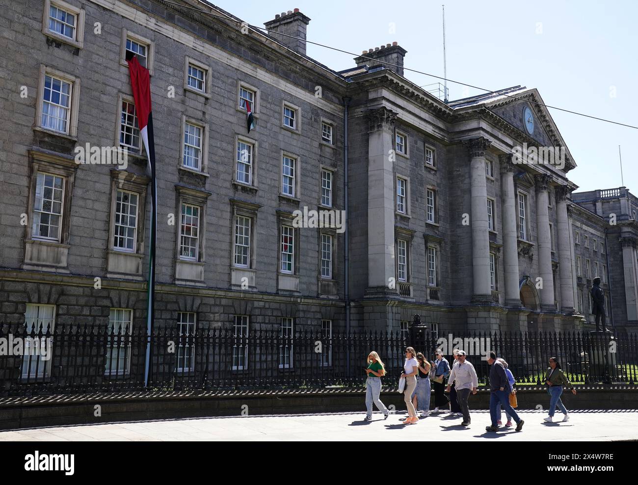 Palestine flags hang from windows of Trinity College in Dublin. The ...