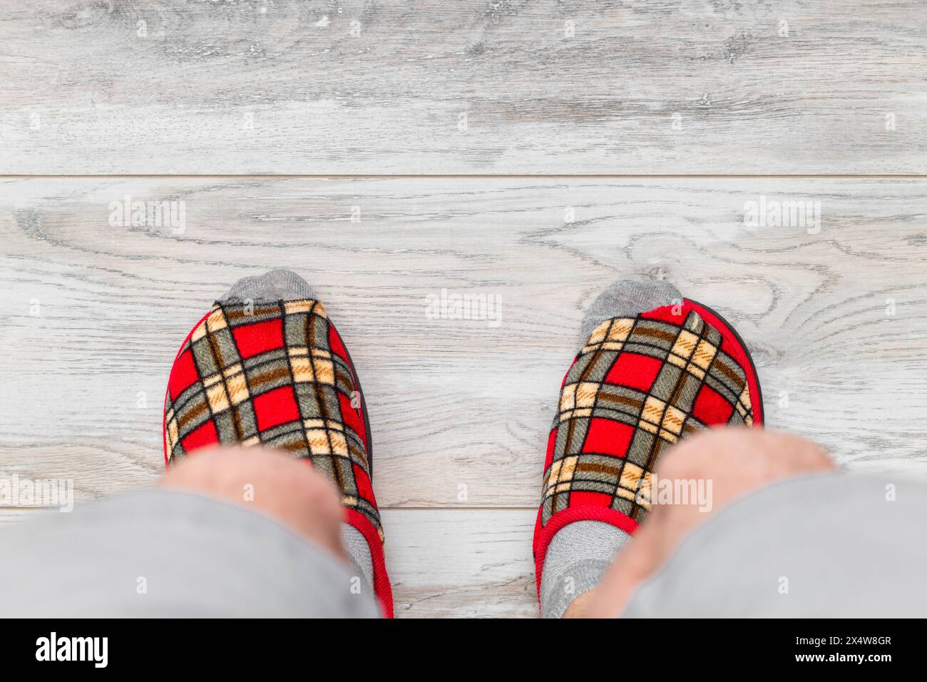 foot shod in an old leaky slipper. old slipper. holey sneaker. hole in ...