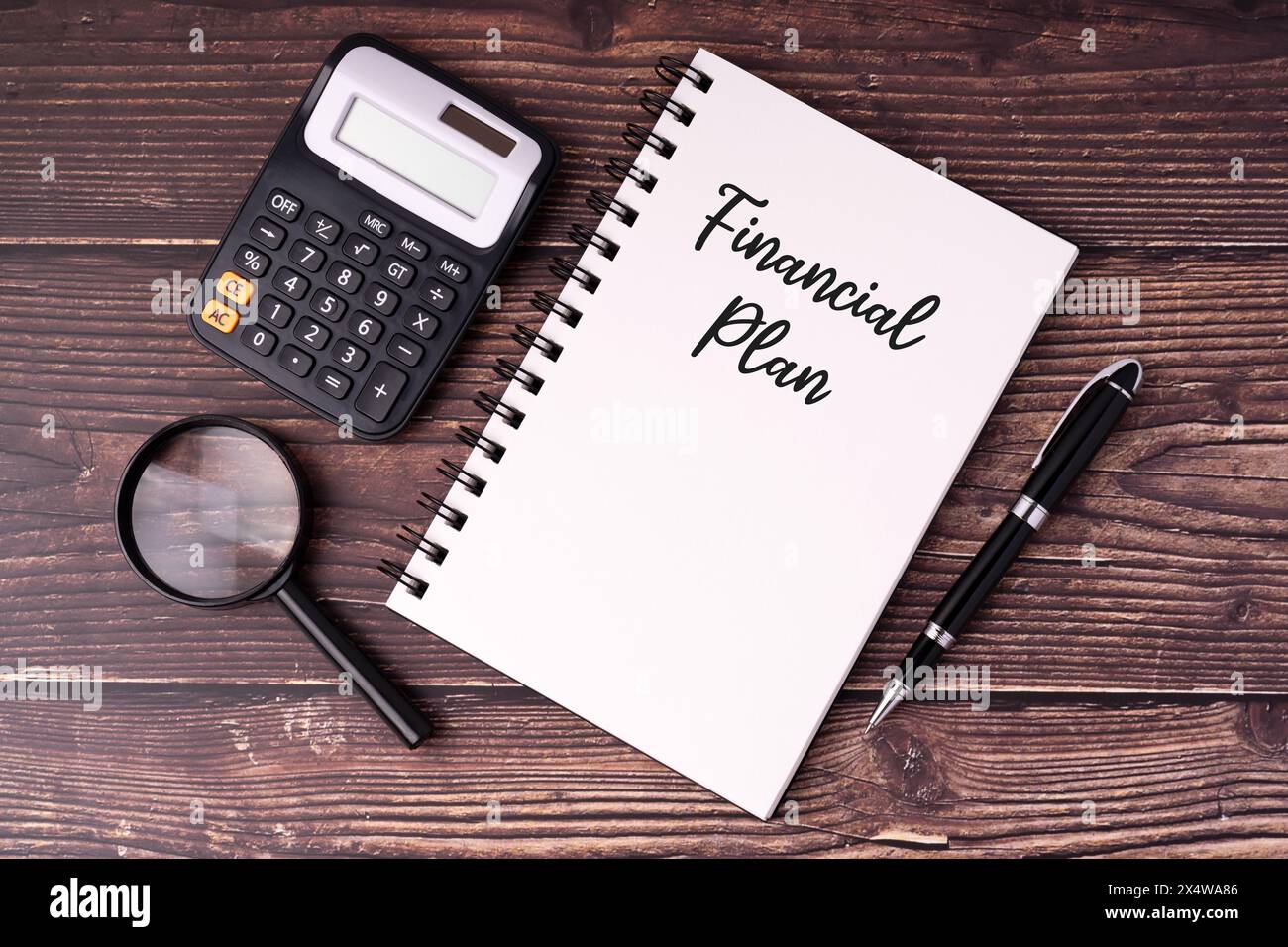 Financial plan text on notepad, pen, calculator, magnifying glass flat ...