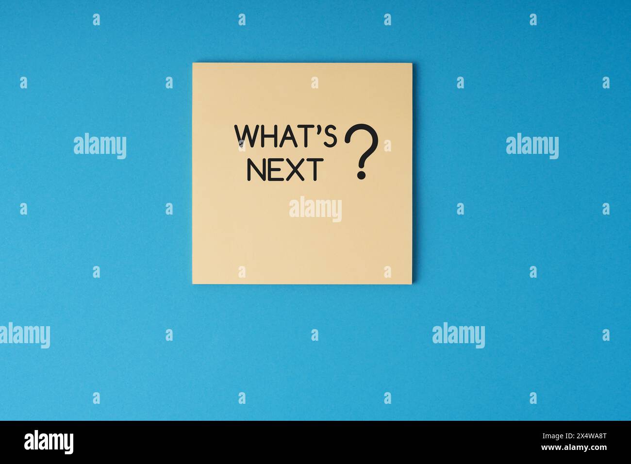 What's next text on adhesive note blue background Stock Photo - Alamy