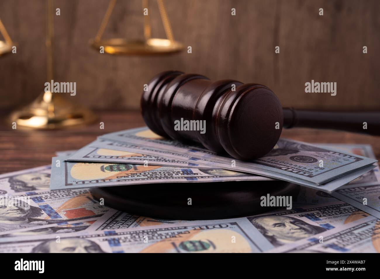 Gavel on top of American 100 dollars money and scale of justice Stock ...