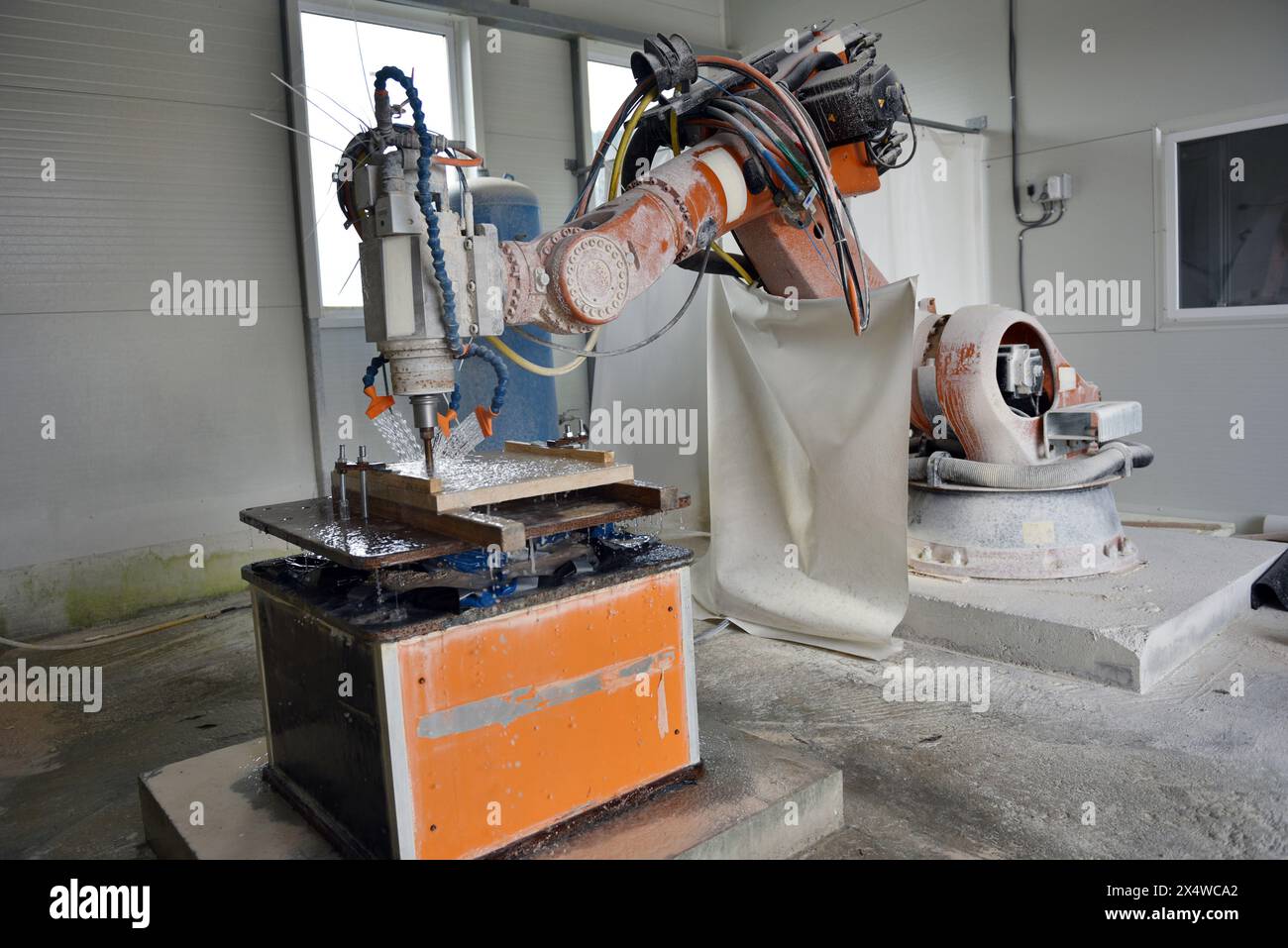 Robot working on milling sculpture in natural stone Stock Photo - Alamy