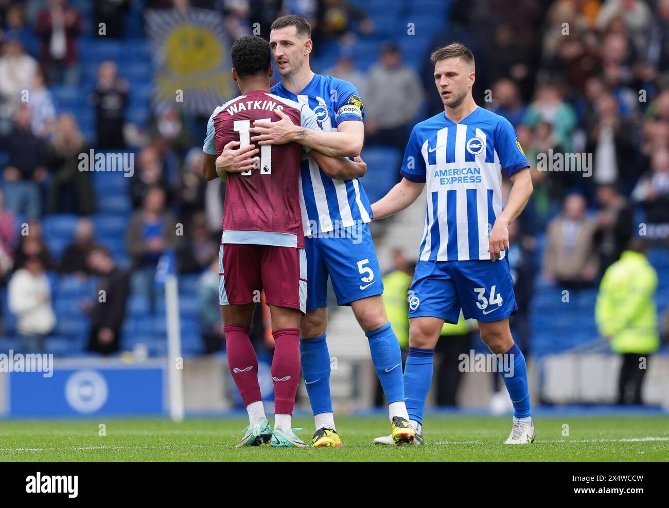 Brighton and Hove Albion's Lewis Dunk embraces Aston Villa's Ollie ...