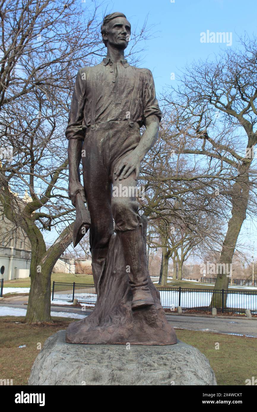 Lincoln the Railsplitter statue with blue sky at Garfield Park in ...