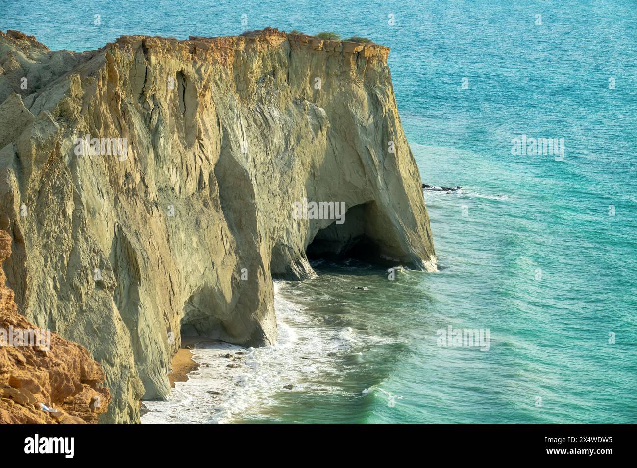 The so-called Red Coast with a red sandy beach, near the rock and the ...