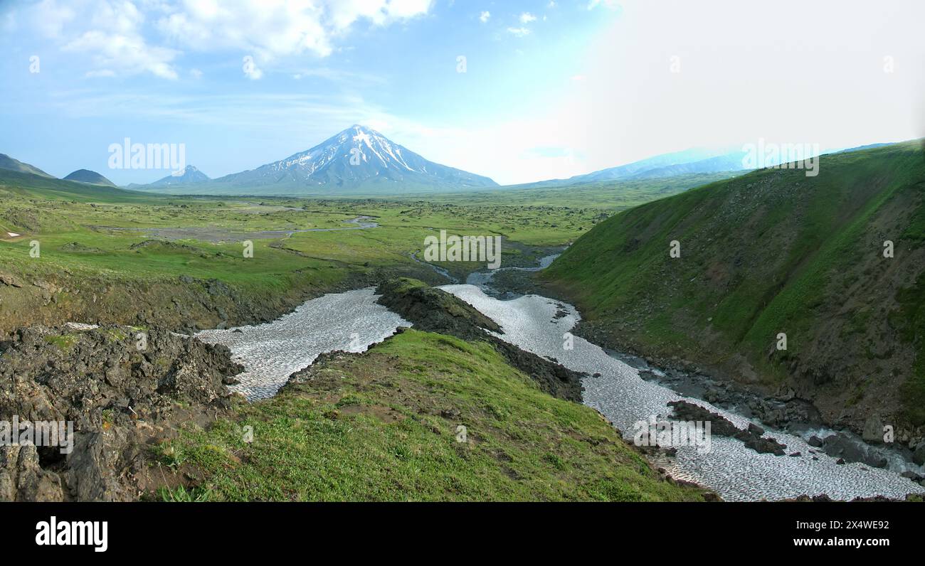 Volcanic plateau and cone of huge volcano on horizon. Subsidence ...