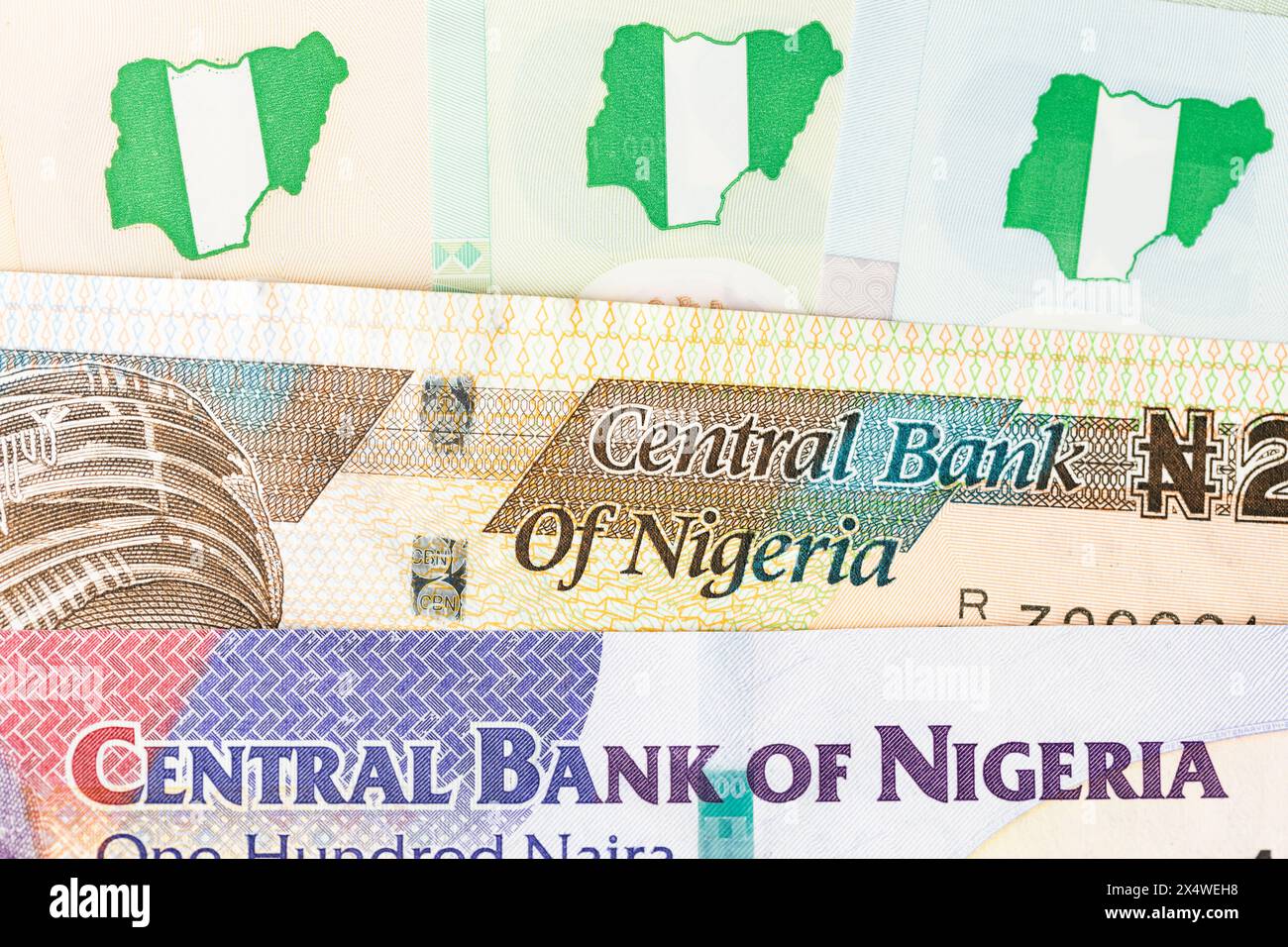 The symbol of the Nigerian money Naira. Nigerian banknotes Stock Photo ...