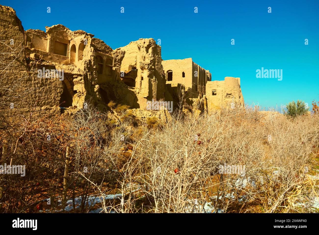 Ruins of an ancient fortress city, buildings made of adobe clay (air ...