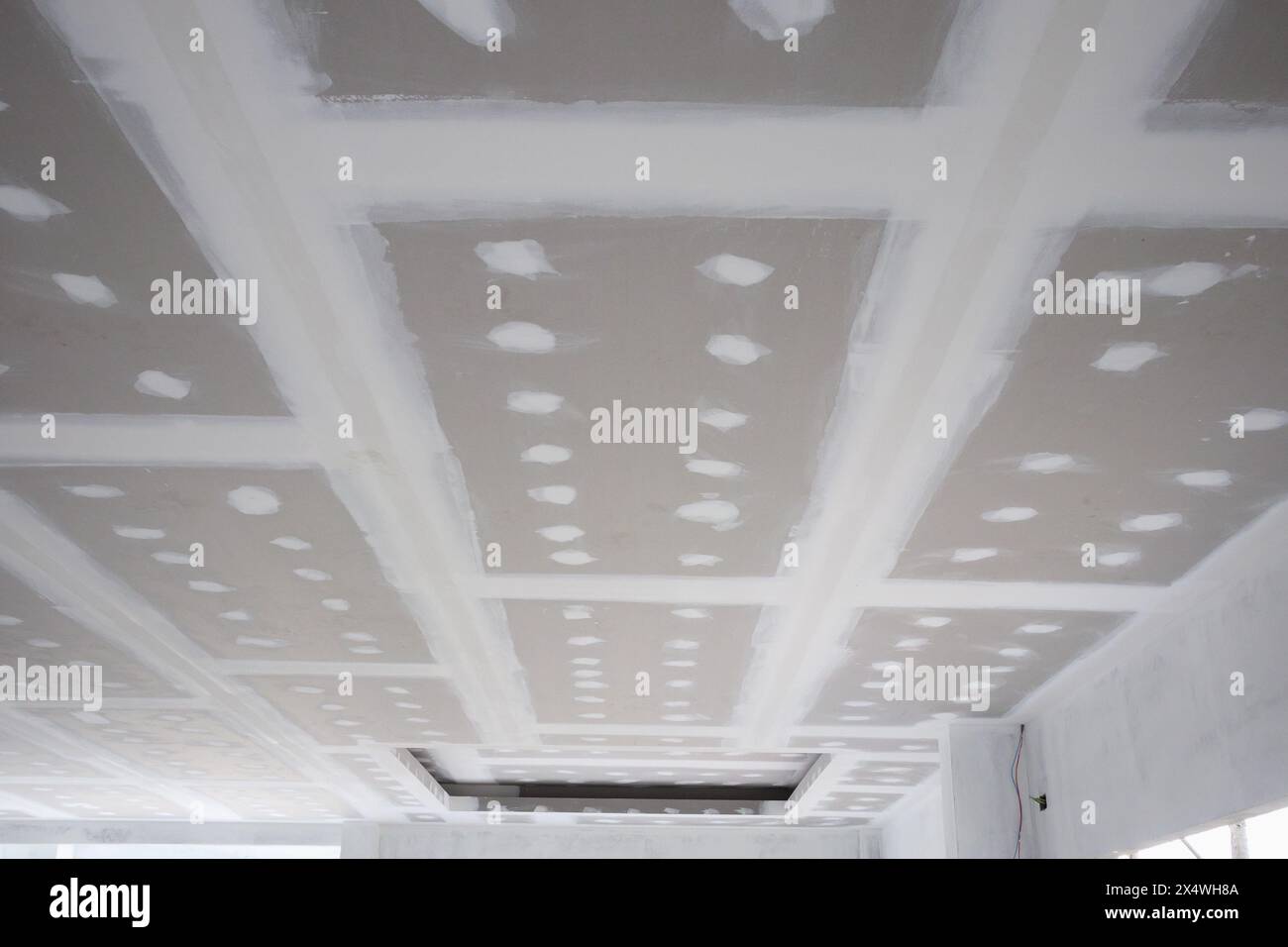 ceiling gypsum board installation at construction site Stock Photo - Alamy