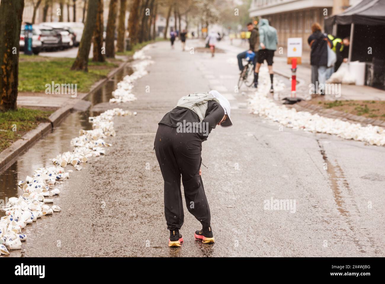 Runners pass finish line hi-res stock photography and images - Alamy