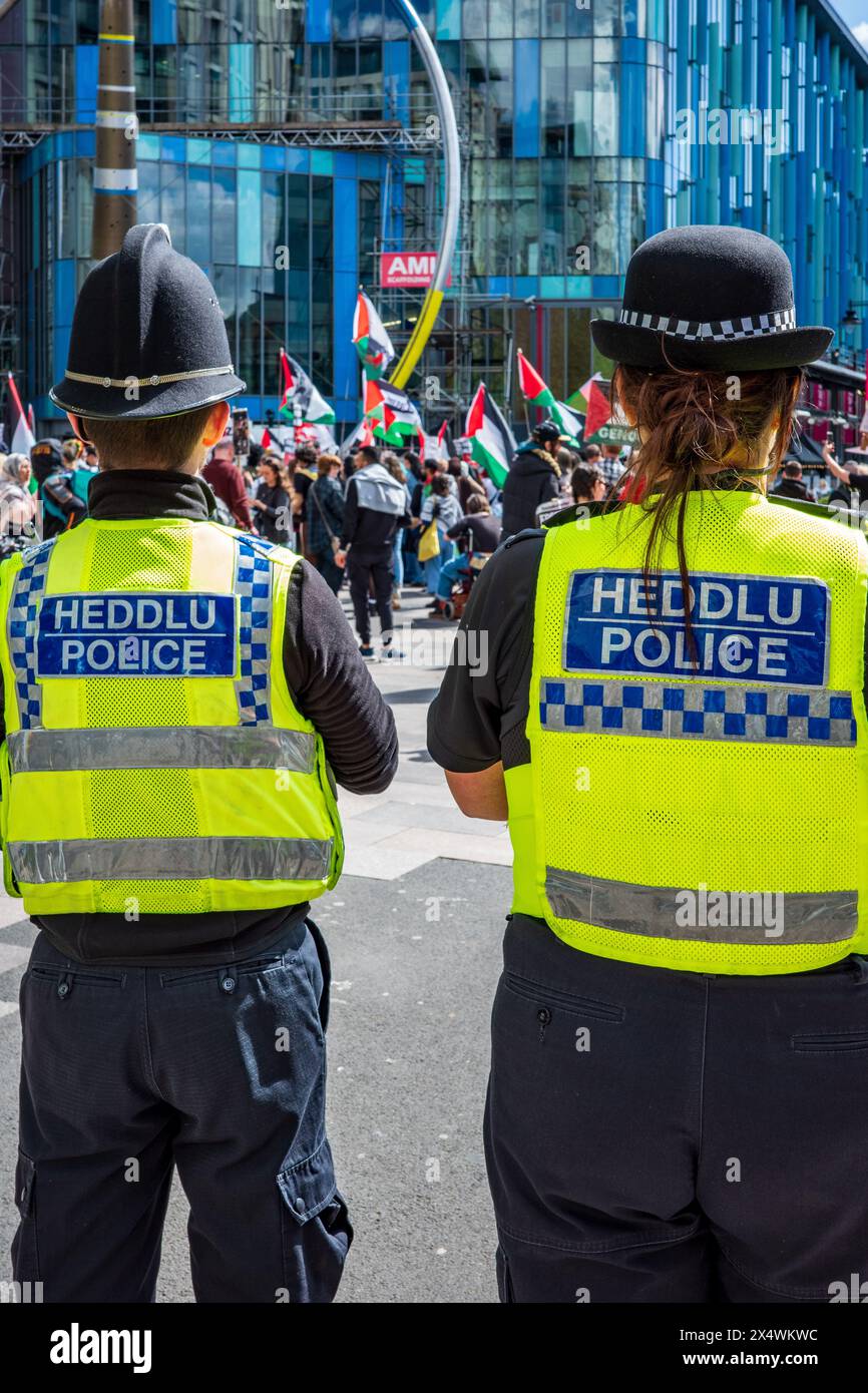 Two police officers watching a Pro-Palestine Protesters in an Anti ...
